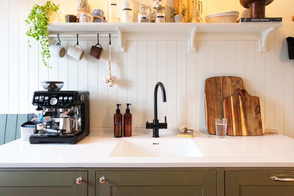 A charming tenement kitchen with shaker-style elegance and thoughtful ...